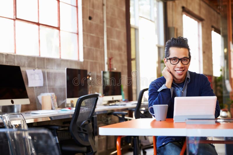 Designer Sitting at Meeting Table Working on Digital Tablet Stock Image ...