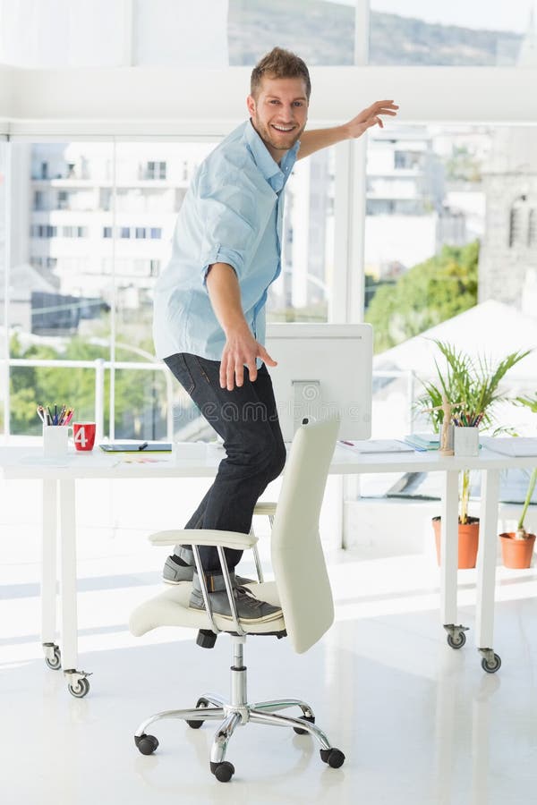 Designer Surfing on His Office Chair Stock Photo - Image of adult ...