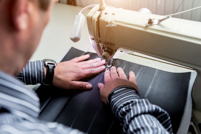 Designer Tailor Sew Seat Covers. Man Use Sewing Machine for His Work ...