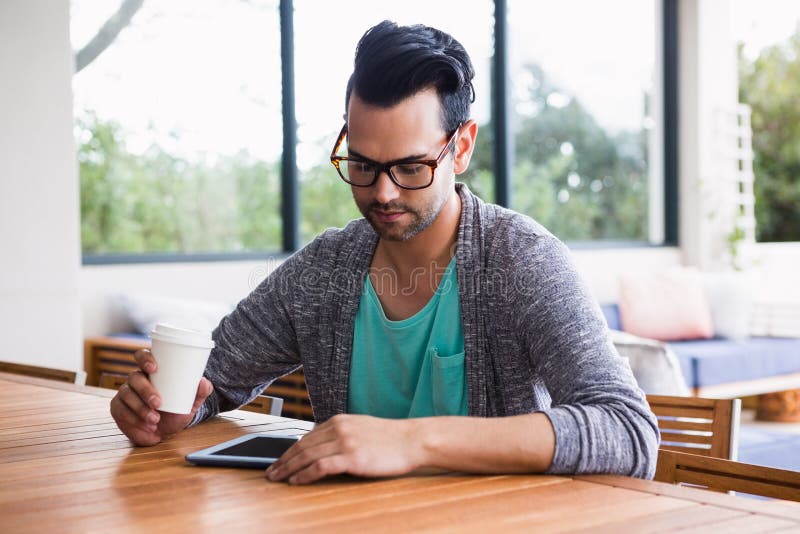 Designer with Take-away Coffee Using Tablet Stock Image - Image of ...