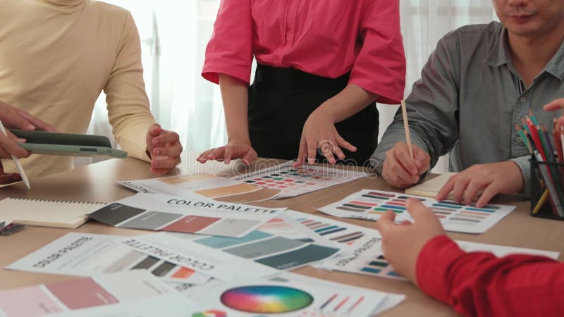 Designer Team Choosing Color for Customer in Office. Variegated Stock ...