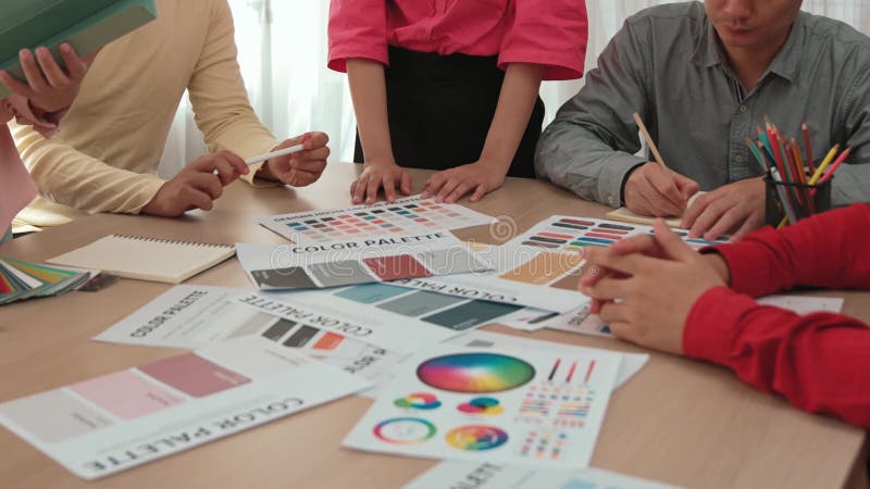 Designer Team Choosing Color for Customer in Office. Variegated Stock ...