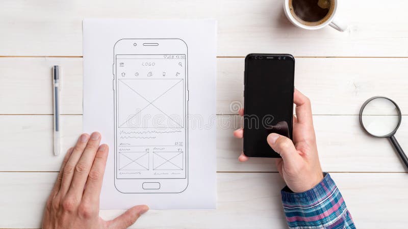 Designer Tests the User Interface and User Experience on a Mobile Phone ...