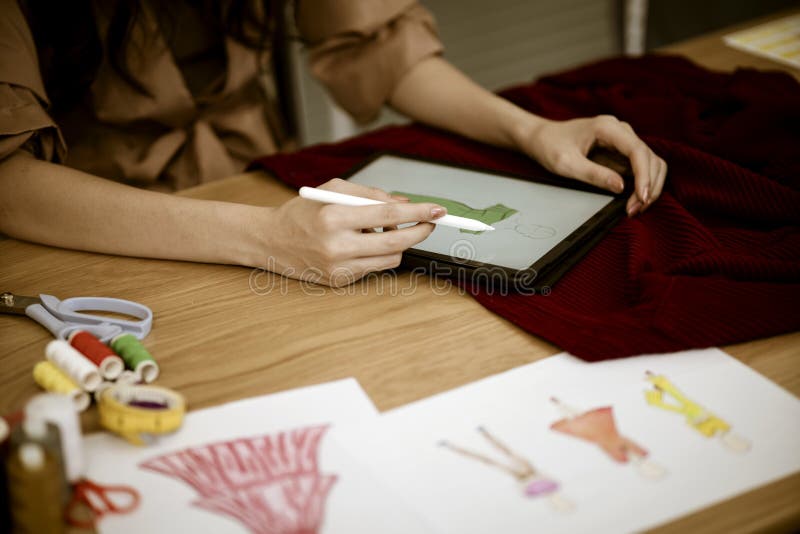Designer is Using Electronic Clothing Design Pencil on a Tablet Stock ...
