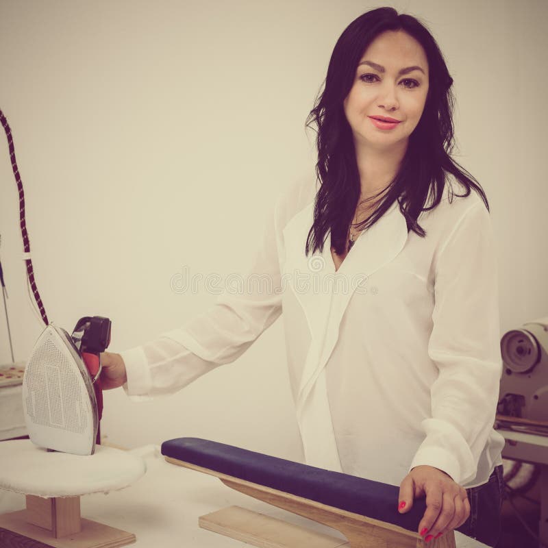 Designer using iron stock photo. Image of clothes, designer - 123228916