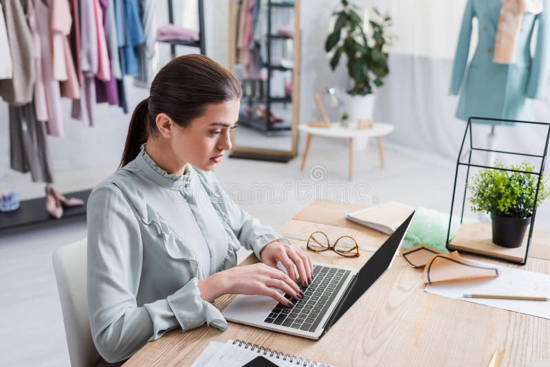 Designer Using Laptop Near Sewing Patterns Stock Photo - Image of craft ...