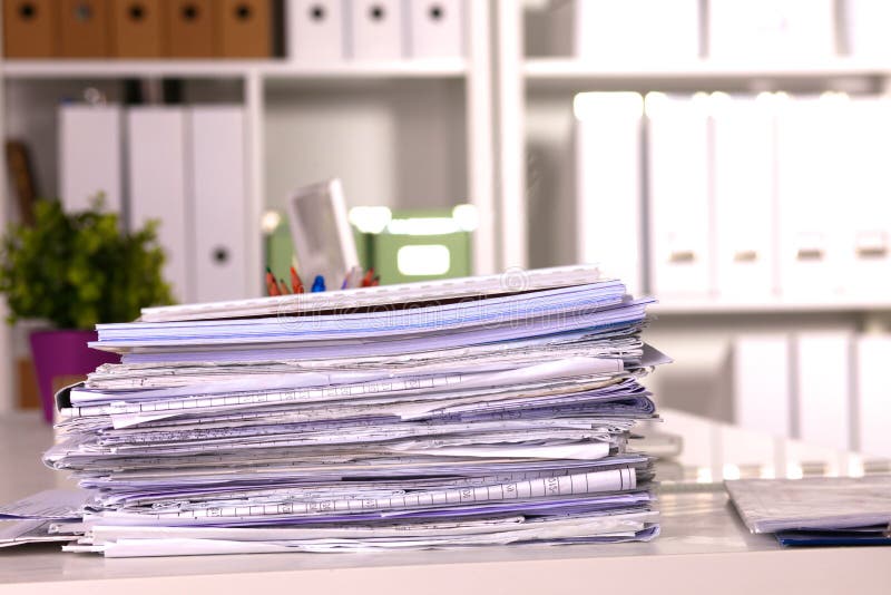Businessman Working in the Office with Piles of Books and Papers Stock ...