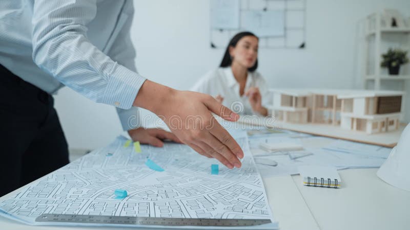 Designer Working while Discussing with Engineer about House Plan ...