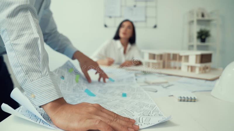 Designer Working while Discussing with Engineer about House Plan ...