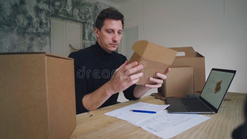 Designer Works, Develops Packaging Design Using Computer and Drawing ...