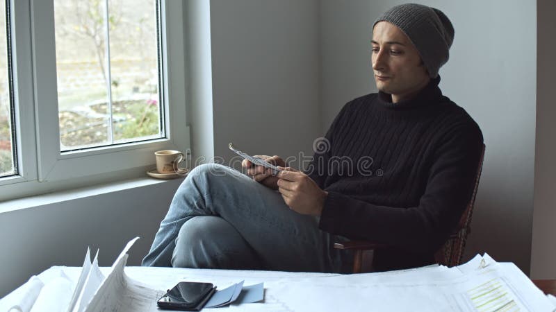 The Designer Works at Home with Drawings and Charts. he Thought and ...