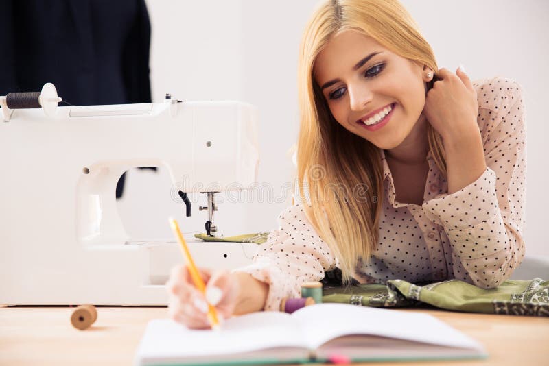 Designer Writing Notes in Workshop Stock Photo - Image of pencil, adult ...