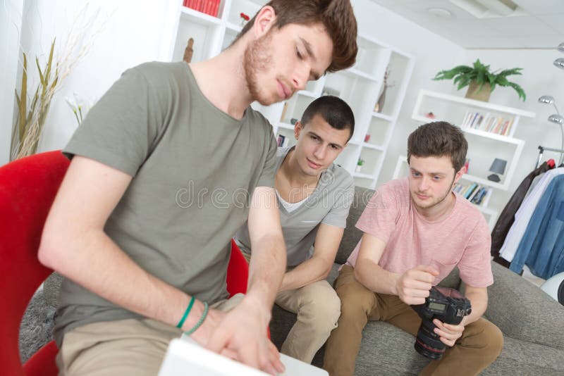 Designers in Office Watching and Choosing Photos on Digital Camera ...