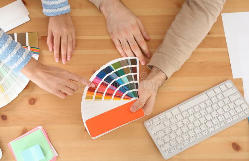 Designers with Paint Color Palette Samples at Table Stock Photo - Image ...