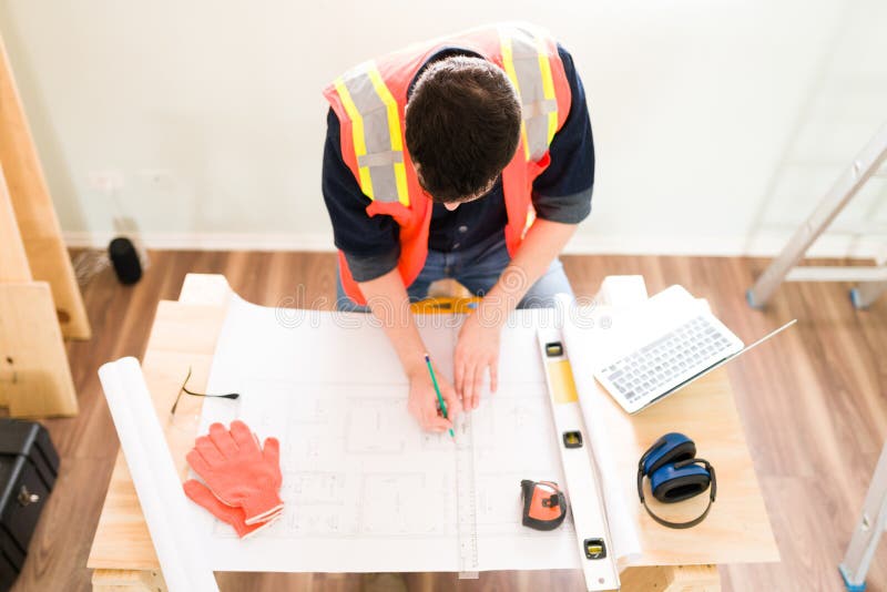 High Angle of a Contractor Working at His Desk Stock Image - Image of ...