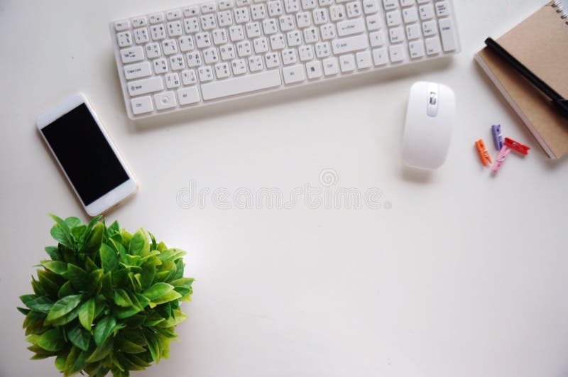 White Office Desk Table with a Lot of Things on it. Stock Photo - Image ...