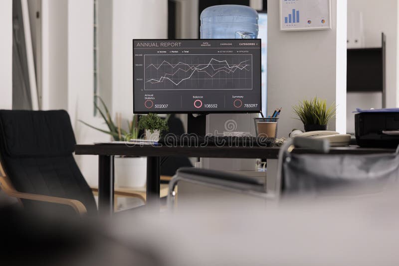 Desk with Annual Report Graphics on Computer Screen Stock Photo - Image ...