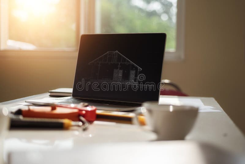 Desk of Architects Engineer with a Blueprint on Table in the Office ...