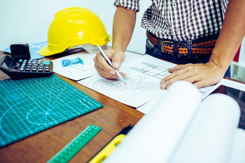 Desk of Architectural Working Project in Construction Site,with Drawing ...