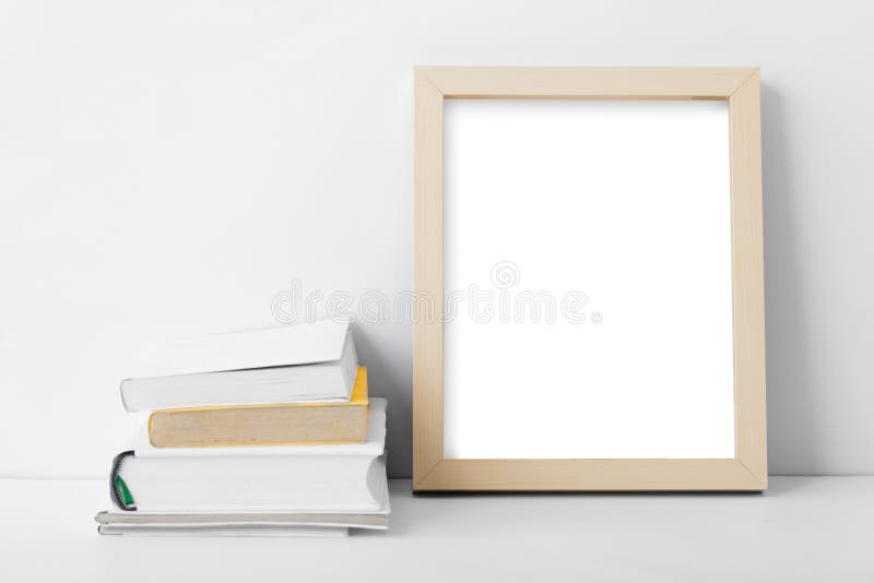 Desk Blank Photo Frame Nest To Stack of Books Stock Image - Image of ...