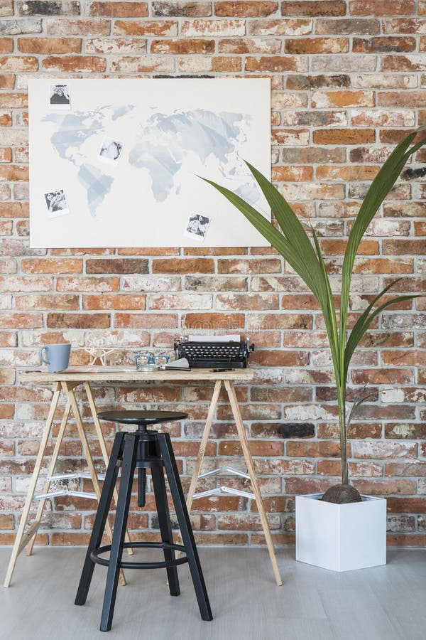 Desk by the brick wall stock image. Image of loft, apartment - 92476455