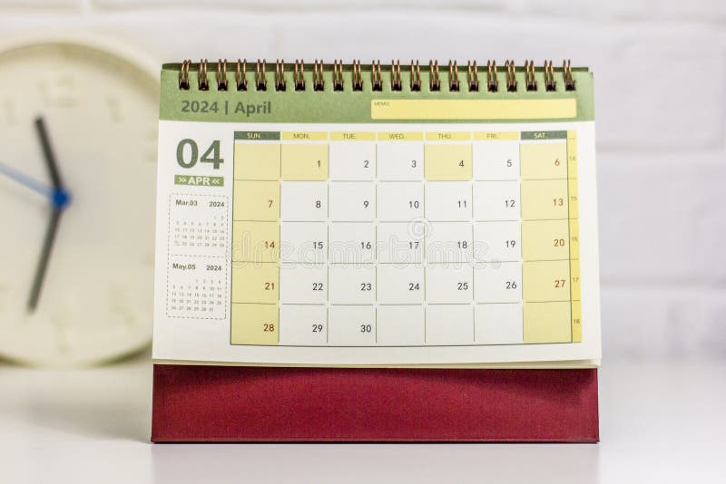 Desk Calendar for April 2024 and a Clock on the Table. Stock Image ...