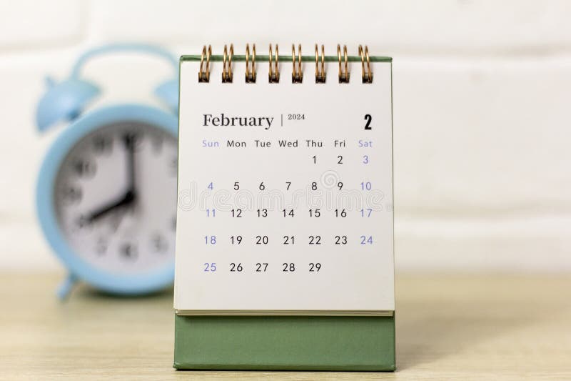 Desk Calendar for February 2024 and a Clock on the Table. Stock Photo ...