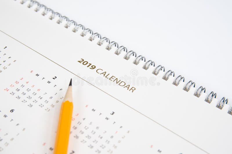 Desk Calendar and Yellow Pencil on White Background. Stock Photo ...