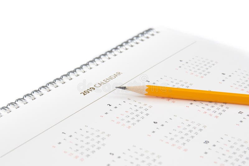 Desk Calendar and Yellow Pencil on White Background. Stock Photo ...