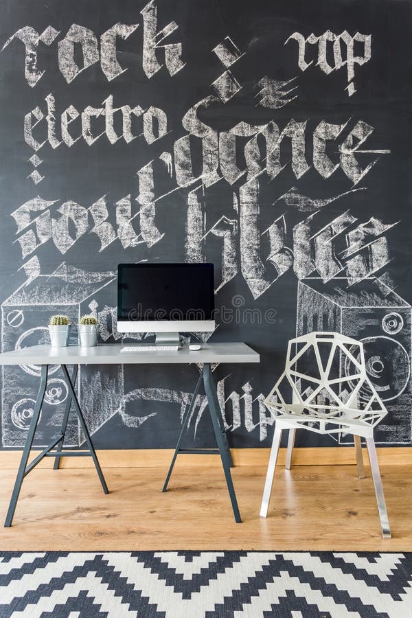 Desk with a Computer Standing Against a Chalkboard Wall Stock Photo ...