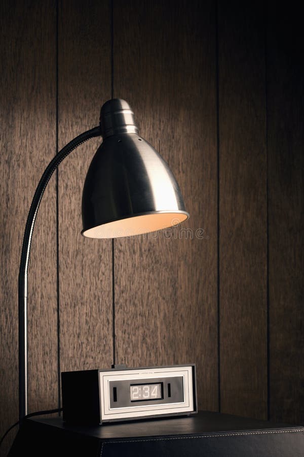 Desk lamp and retro clock. stock photo. Image of colour - 2042688
