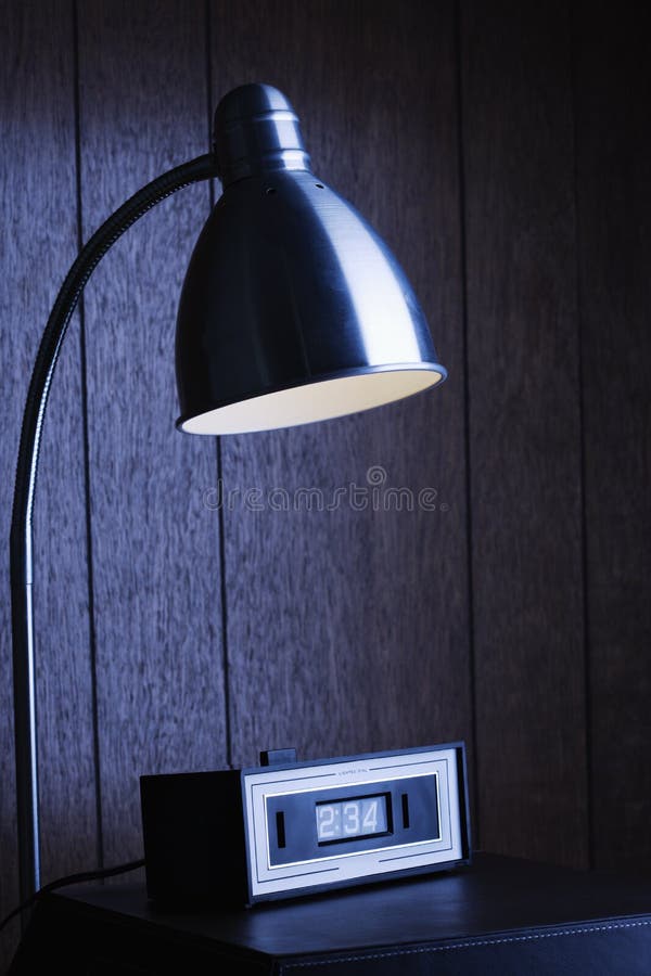 Desk lamp and retro clock. stock image. Image of night - 2047213