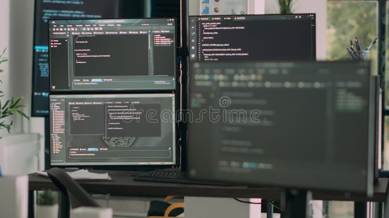 Desk with Multiple Monitors Displaying Terminal Window and Artificial Intelligence Stock Footage ...