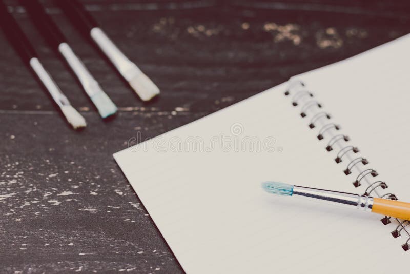 Desk with Notepads and Watercolour Brushes Stock Image - Image of ...