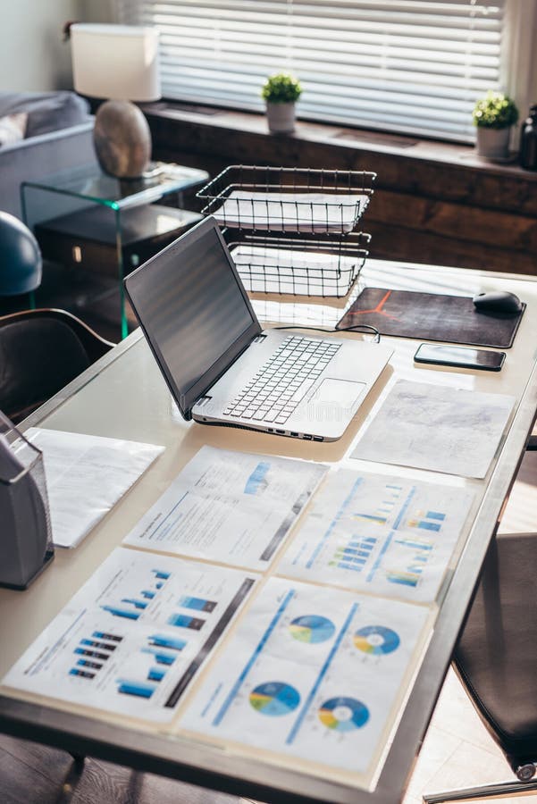 Laptop And Documents On Desk In Office Stock Photo - Image of documents ...