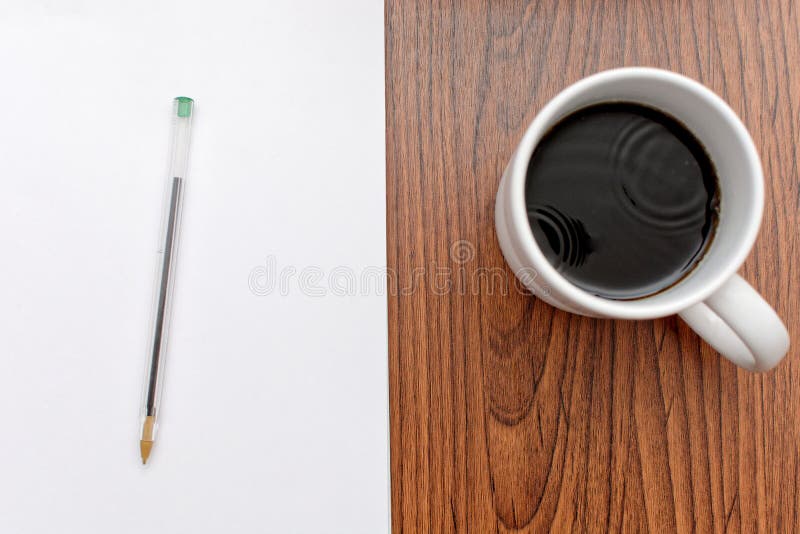 Desk with Papers, Books, Pens and a Cup of Coffee on Top Stock Photo ...