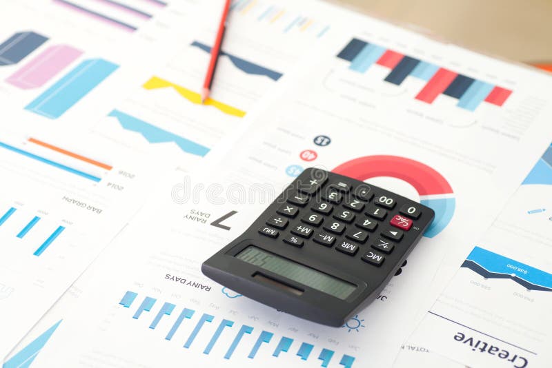 A Desk of Papers and a Calculator Stock Photo - Image of calculations ...