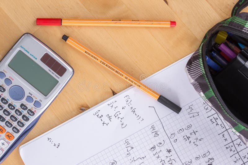 Desk with Calculator Glasses Pens Maths Homework Exercise Book ...