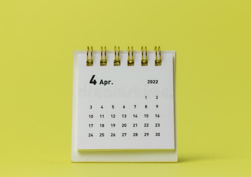 Desktop Calendar for April 2022 on a Yellow Background Stock Image ...