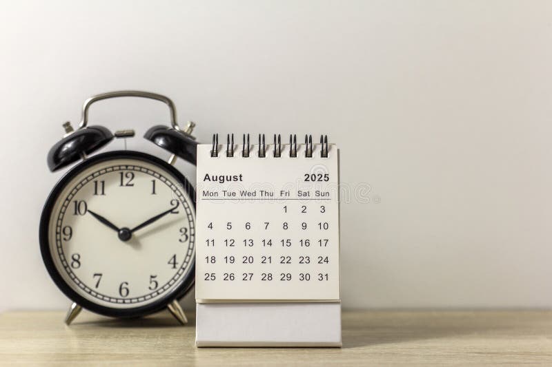A Desktop Calendar for August 2025 and a Clock on the Table, Where ...