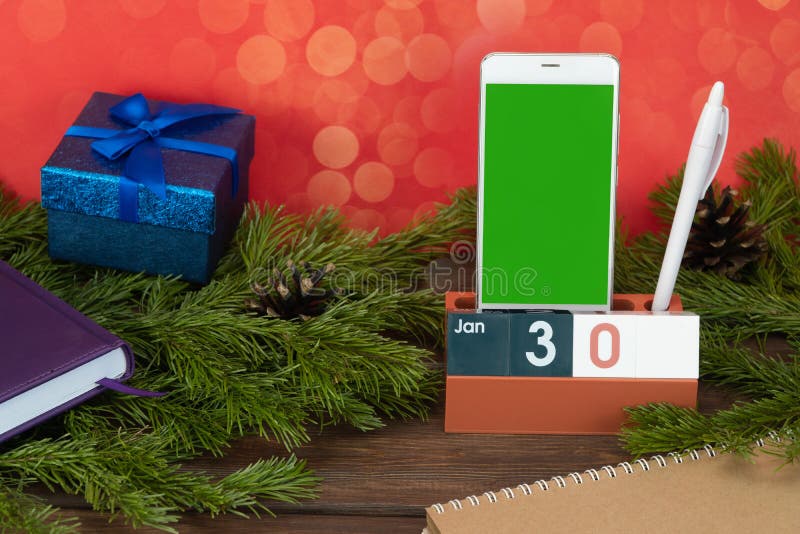 Desktop Calendar with the Date January 30 and a Cell Phone. Layout for ...