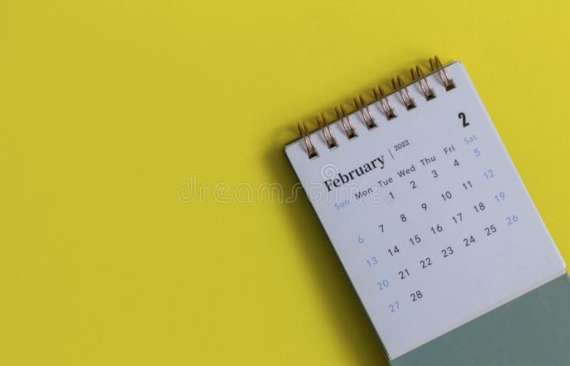 Desktop Calendar for February 2022 on a Yellow Background Stock Image ...
