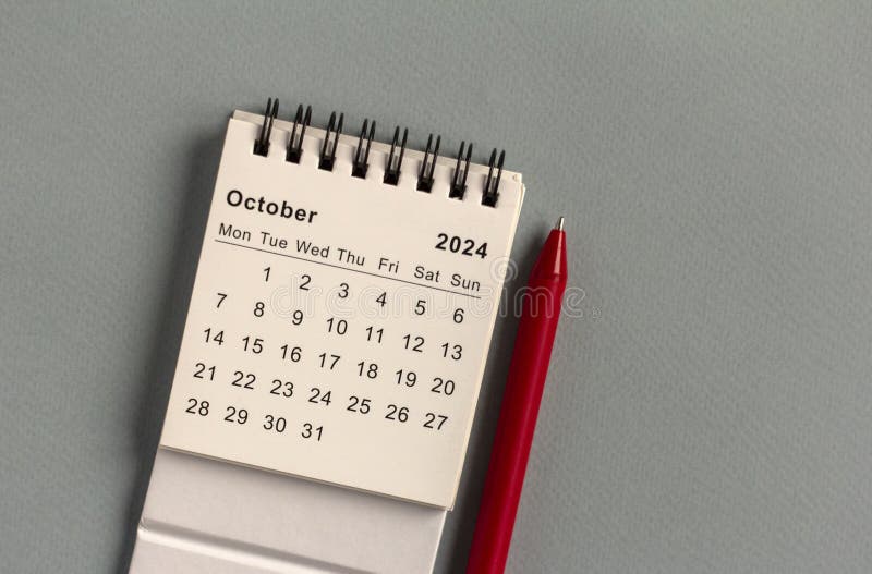 The Desktop Calendar for October 2024 is on the Table Stock Photo ...