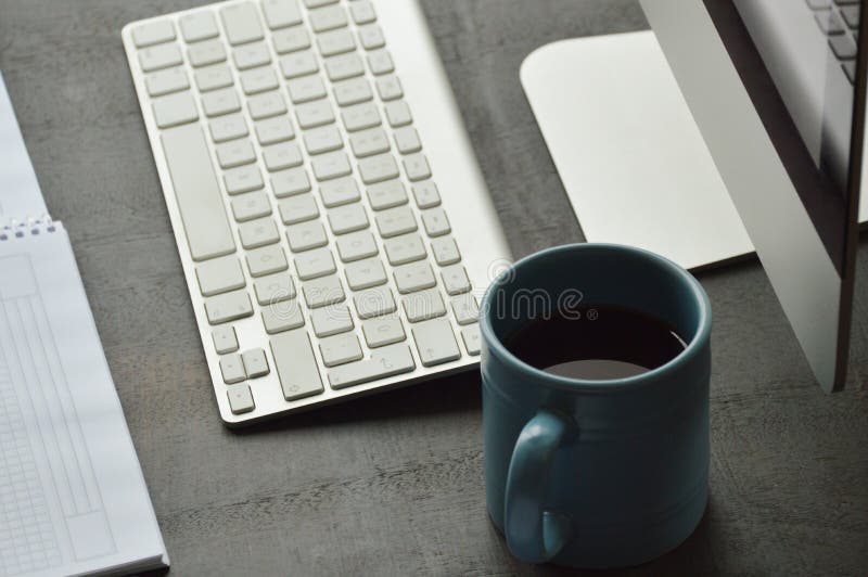 Desktop Computer, Cup of Coffee and Note Pad on the Office Desk Stock ...