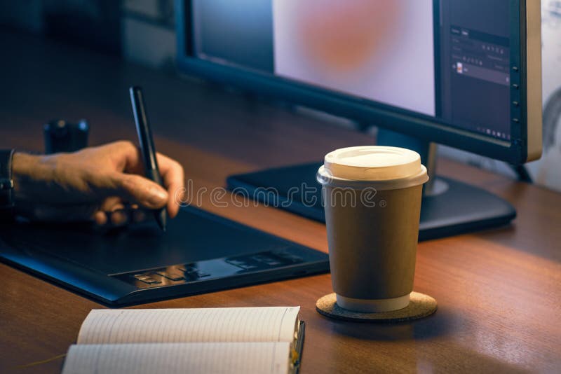 Desktop with Computer, Graphics Tablet and a Cup of Coffee. Side View ...