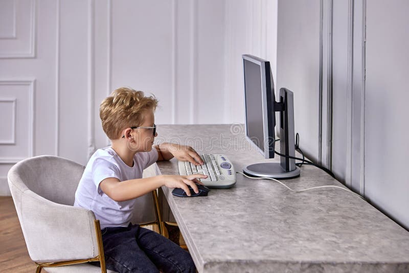 Desktop Computer with Little Boy during E-learning during Pandemic ...