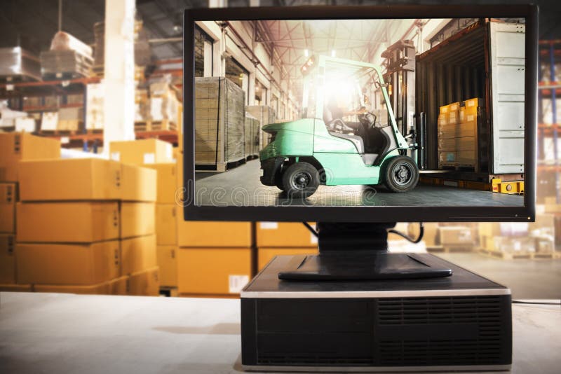 Desktop Computer on Table with Forklift Tractor Loading on Screen ...