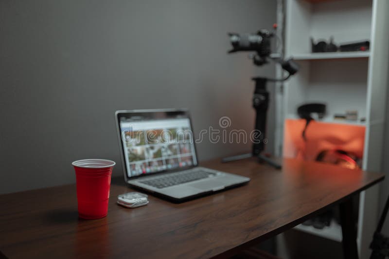 Desktop of the Content Creator with the Laptop and Red Cup Stock Photo ...