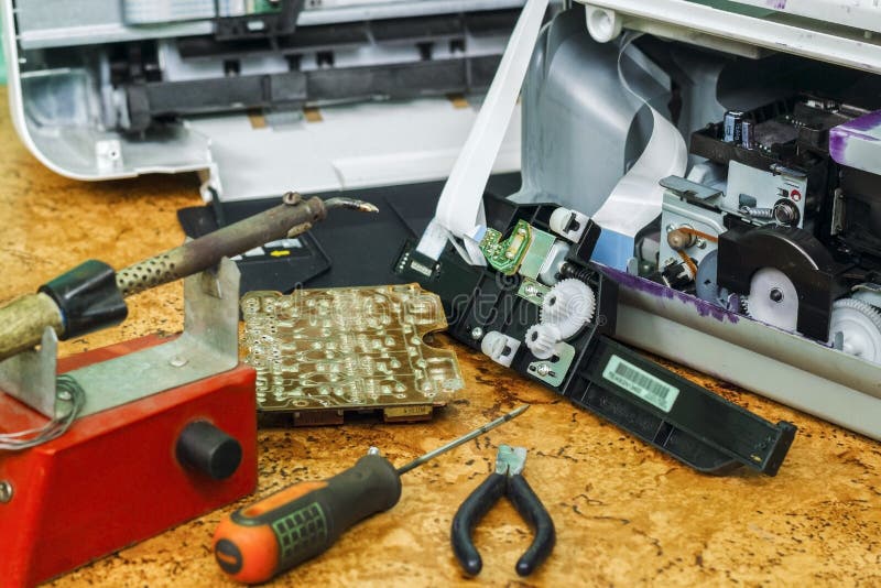 On the Desktop is Disassembled Equipment and Tools for Repair. Stock ...