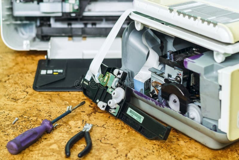 On the Desktop is Disassembled Equipment and Tools for Repair. Stock ...